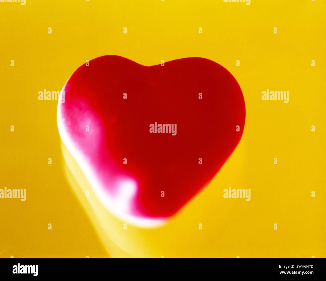 heart shaped jelly confectionery isolated on yellow background, sweet ...