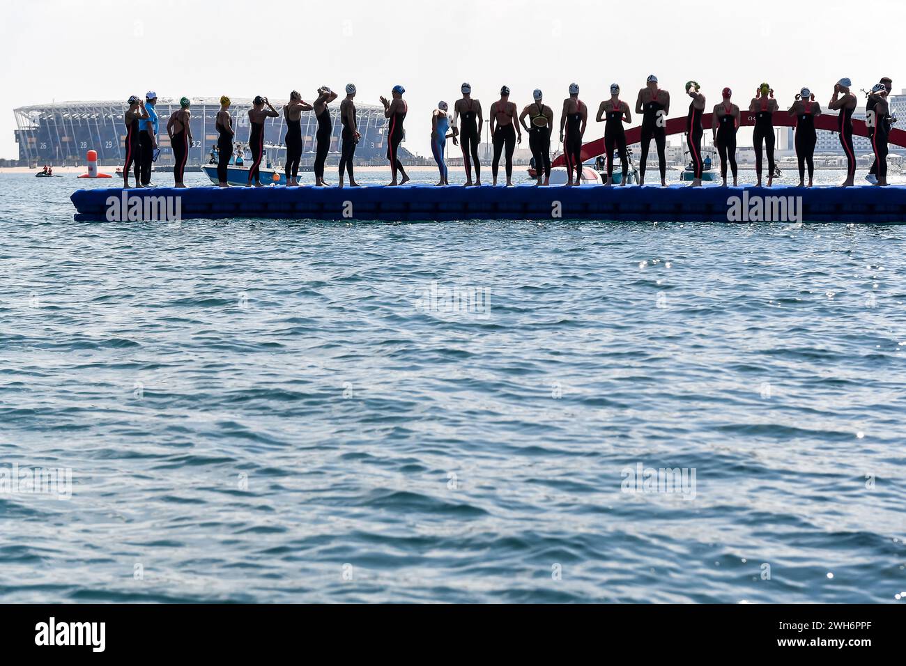 Doha, Qatar. 08th Feb, 2024. Athletes compete in the open water 4x1500m ...