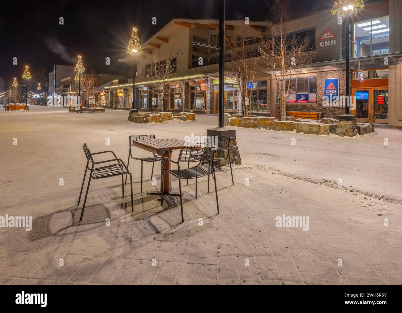 Banff, Alberta, Canada – February 06, 2024: Table and chairs at night ...