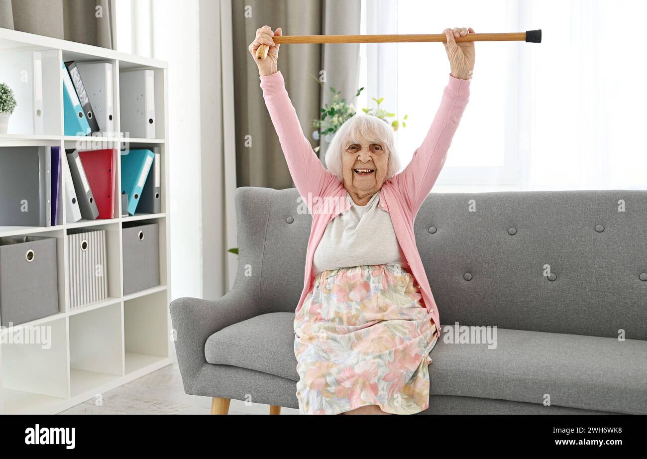 Elderly Woman Lifts Walking Cane Upwards Symbolizes Victory Over ...