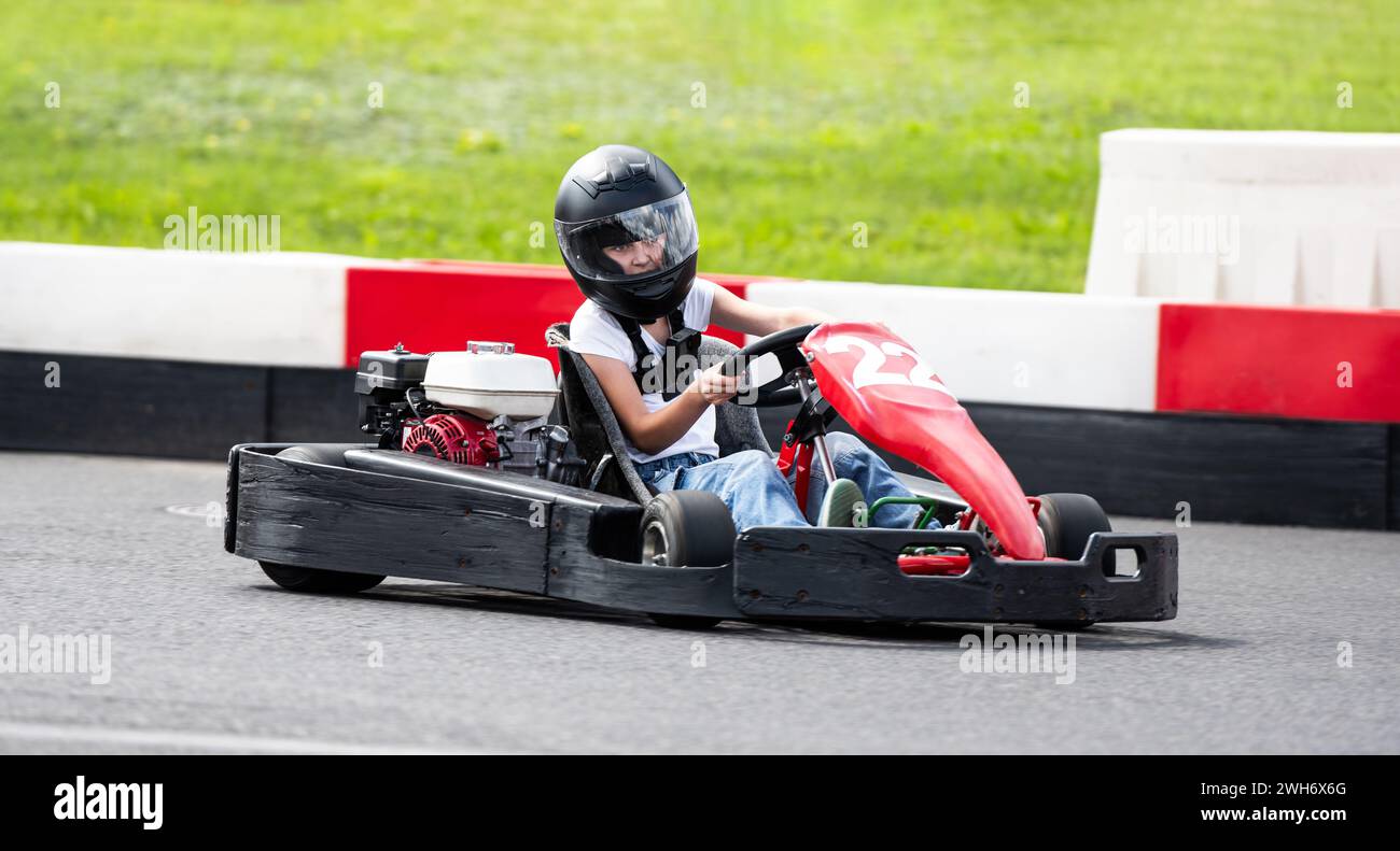 Little Girl Drives Fast Kid'S Go-Kart By Racing Track Stock Photo - Alamy