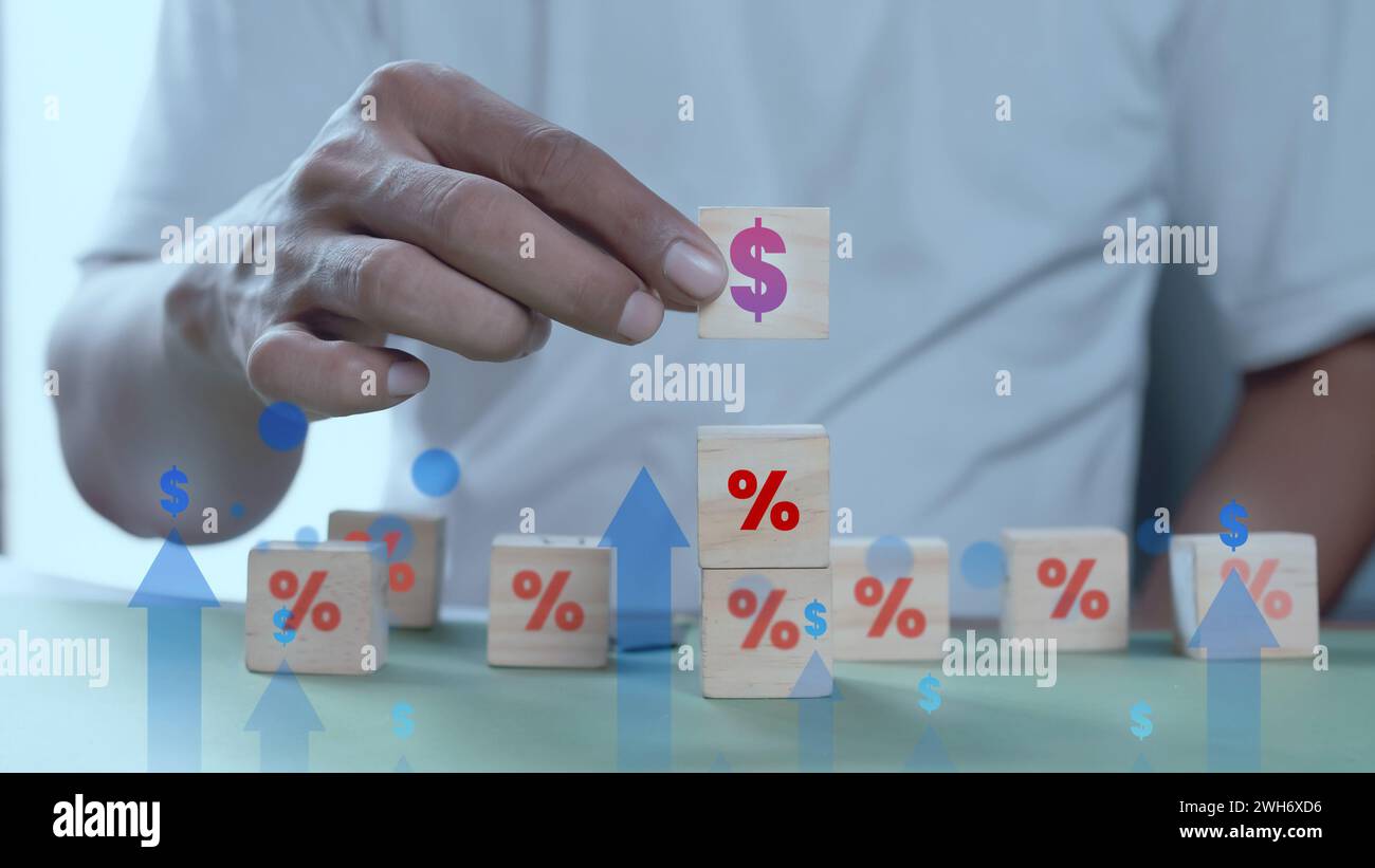 Businessman stacking wooden blocks with dollar icons. Increase sales ...