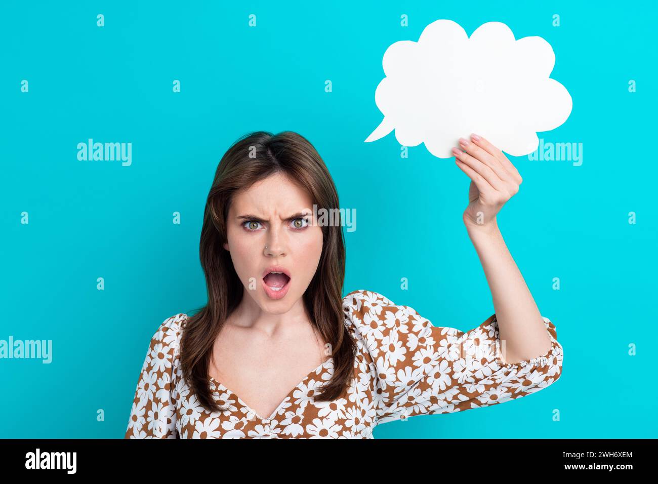 Photo of furious shocked woman wear flower print top open moth rising mind cloud empty space ...