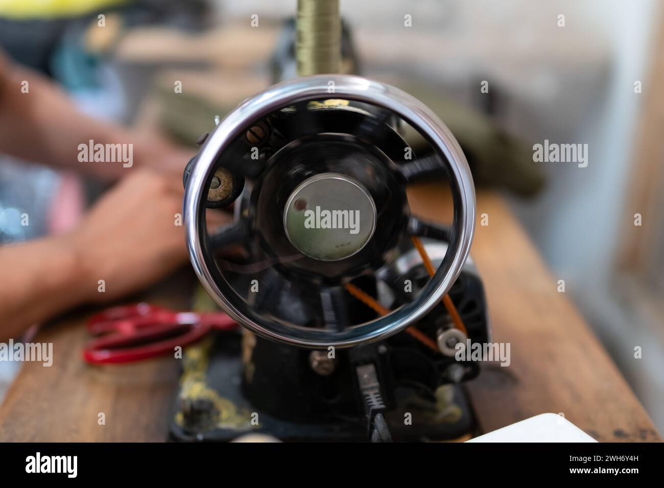 The tailor uses an old sewing machine Stock Photo - Alamy