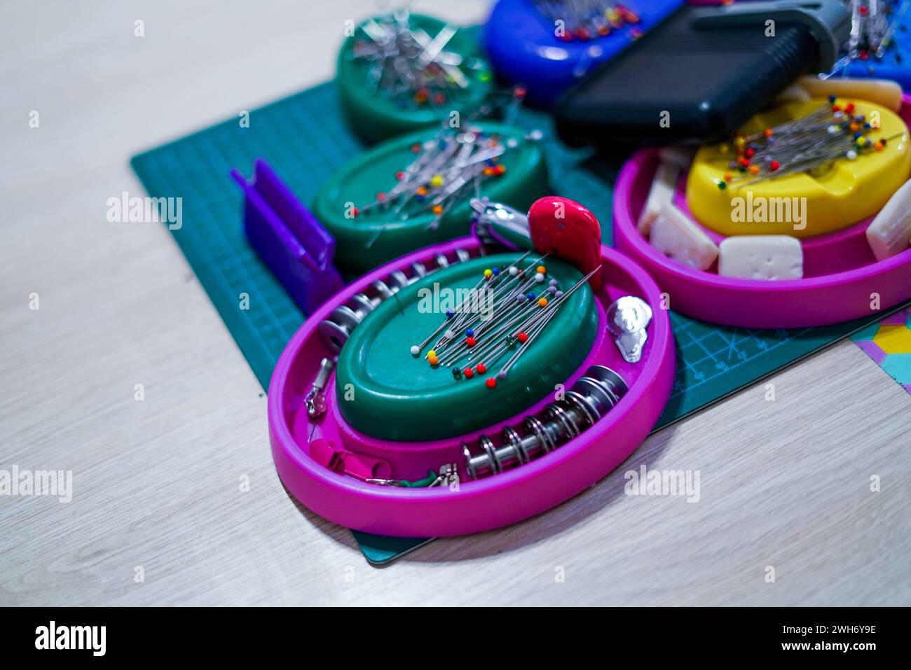Colorful pins and scissors in the sewing studio Stock Photo - Alamy