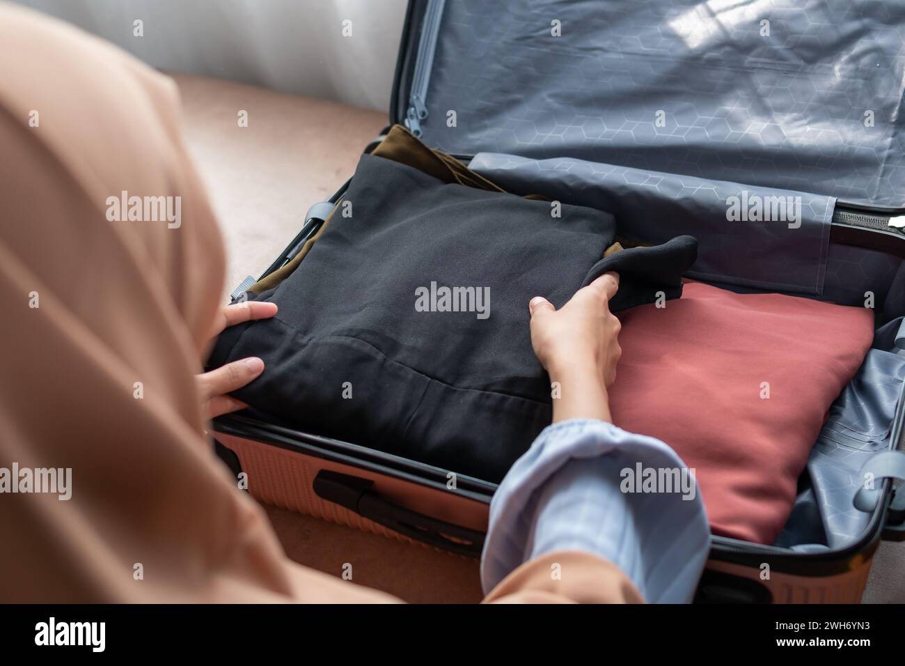 Women pack clothes in suitcases for travel, adventure and vacation in ...