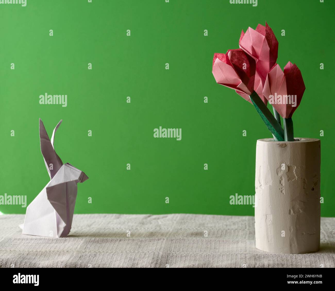 pink tulips and origami rabbit with green background Stock Photo - Alamy