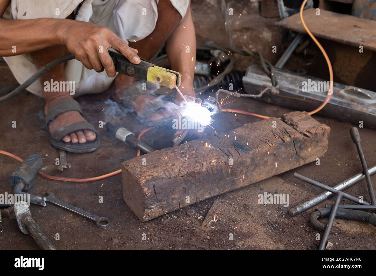 Welders work on welding metal. Men working in welding workshop Stock ...