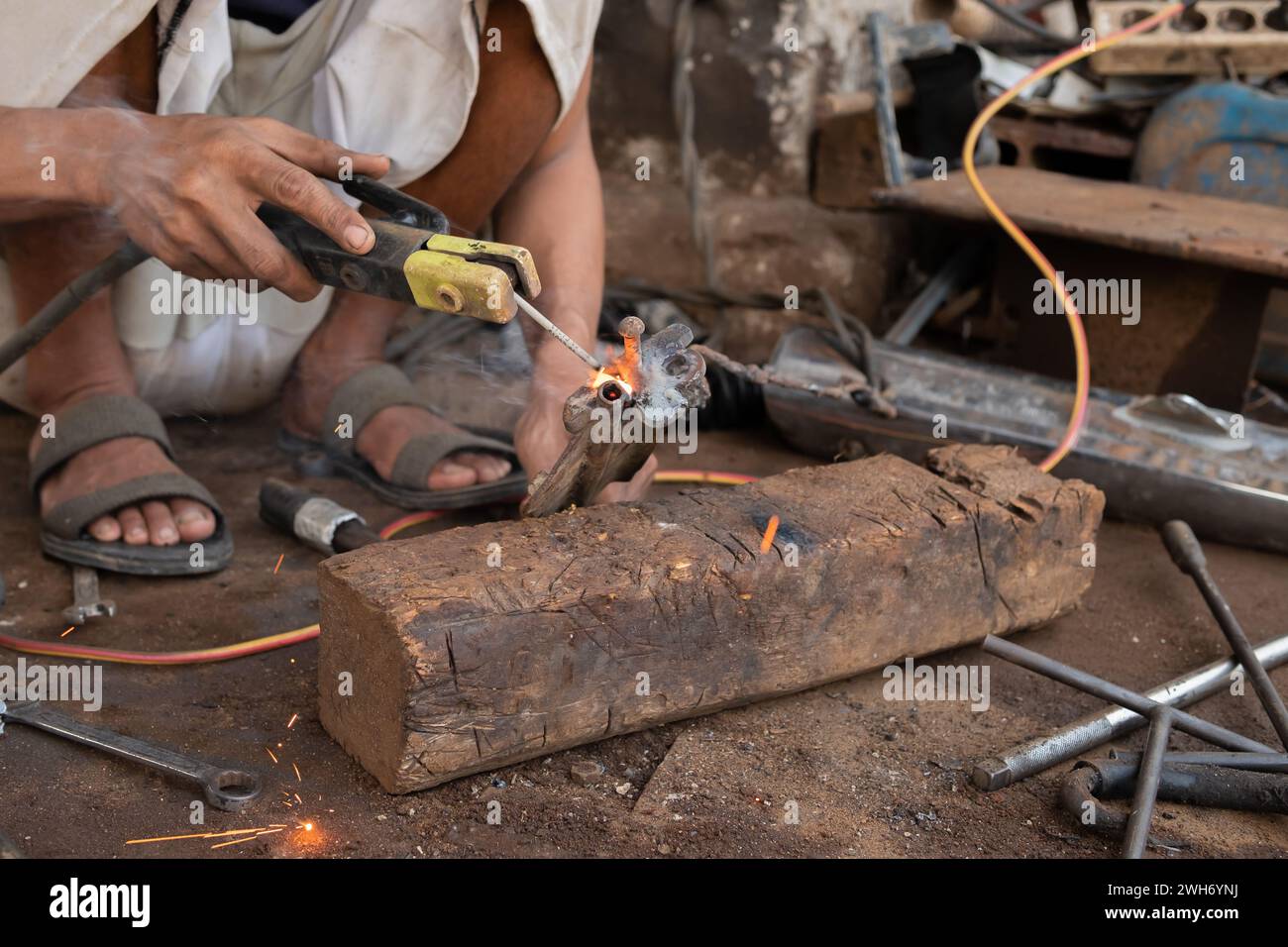 Welders work on welding metal. Men working in welding workshop Stock ...
