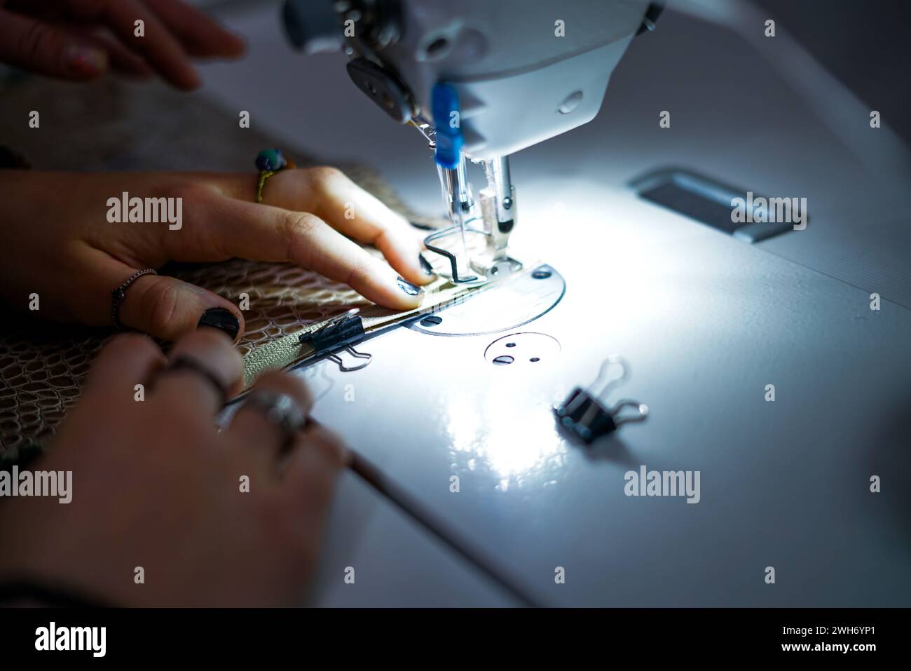 Working in the sewing studio. Sewing machine Stock Photo - Alamy