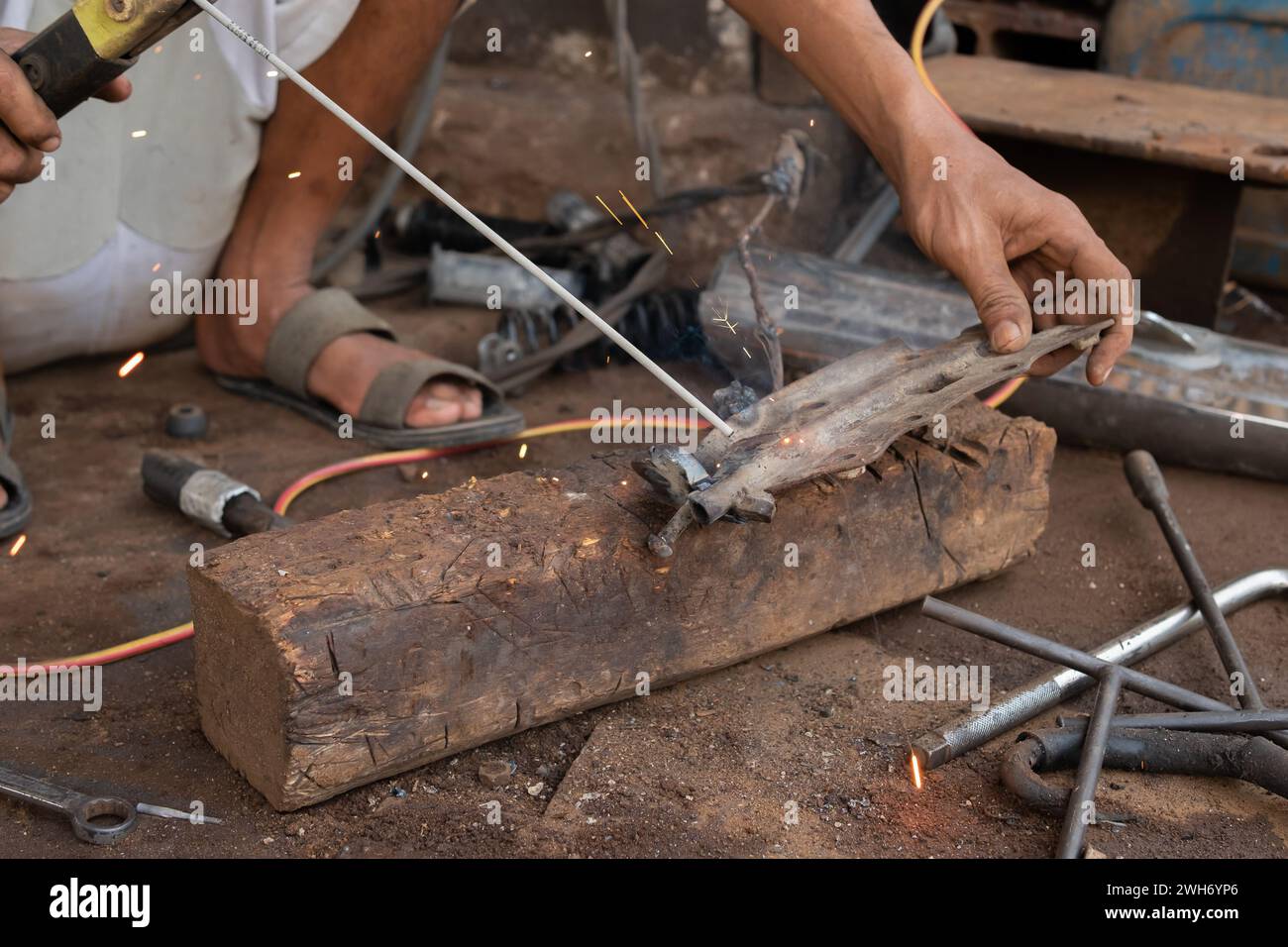 Welders work on welding metal. Men working in welding workshop Stock ...