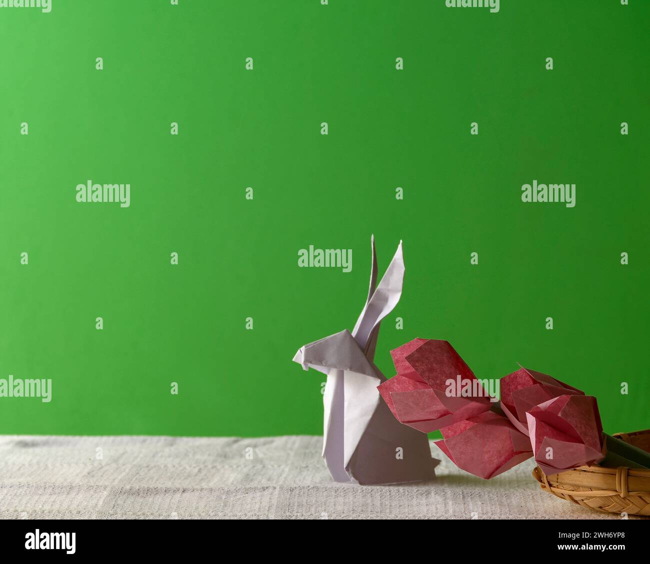 pink tulips and origami rabbit with green background Stock Photo - Alamy