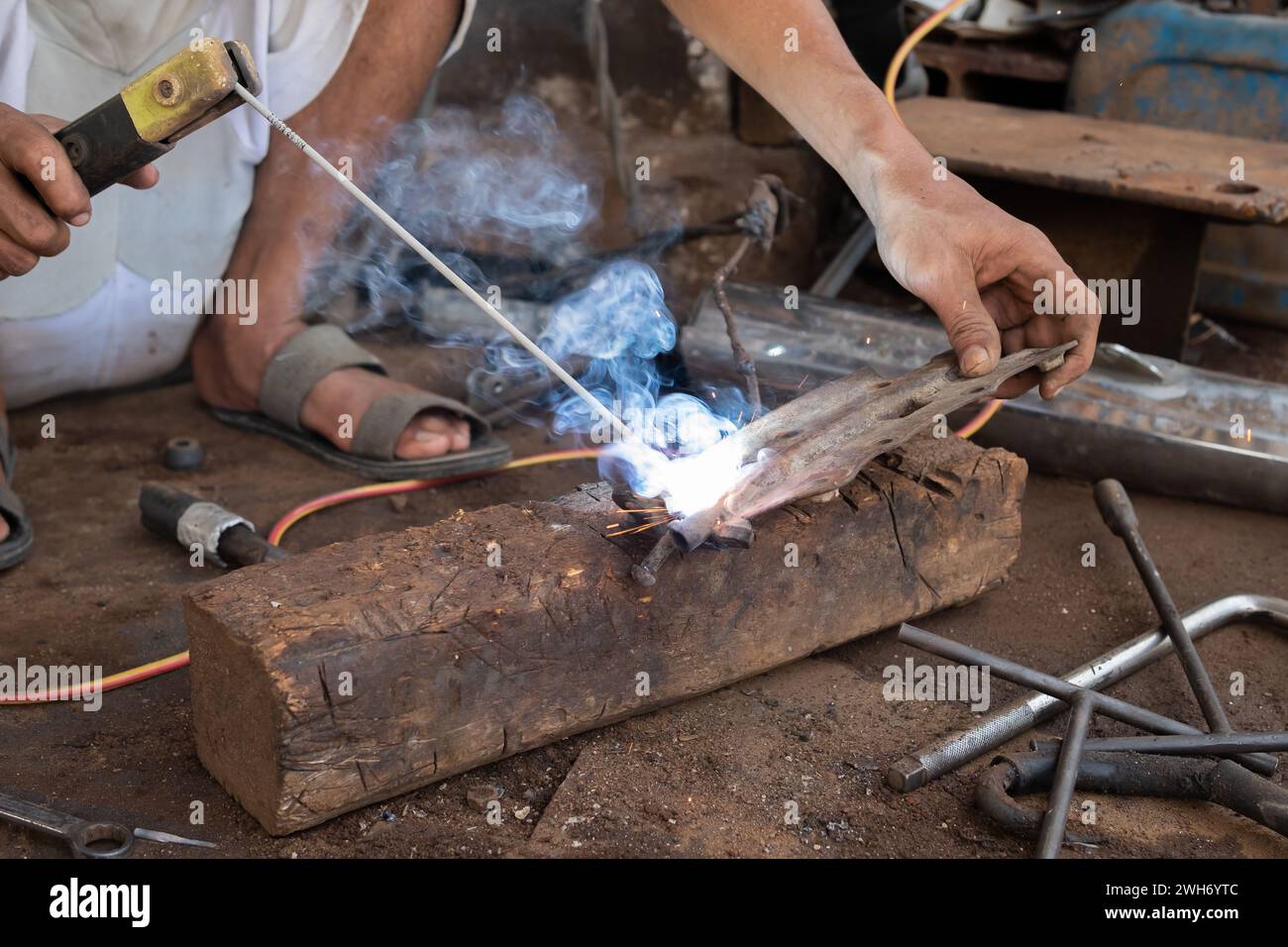 Welders work on welding metal. Men working in welding workshop Stock ...