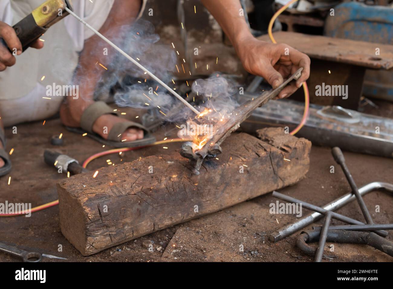 Welders work on welding metal. Men working in welding workshop Stock ...