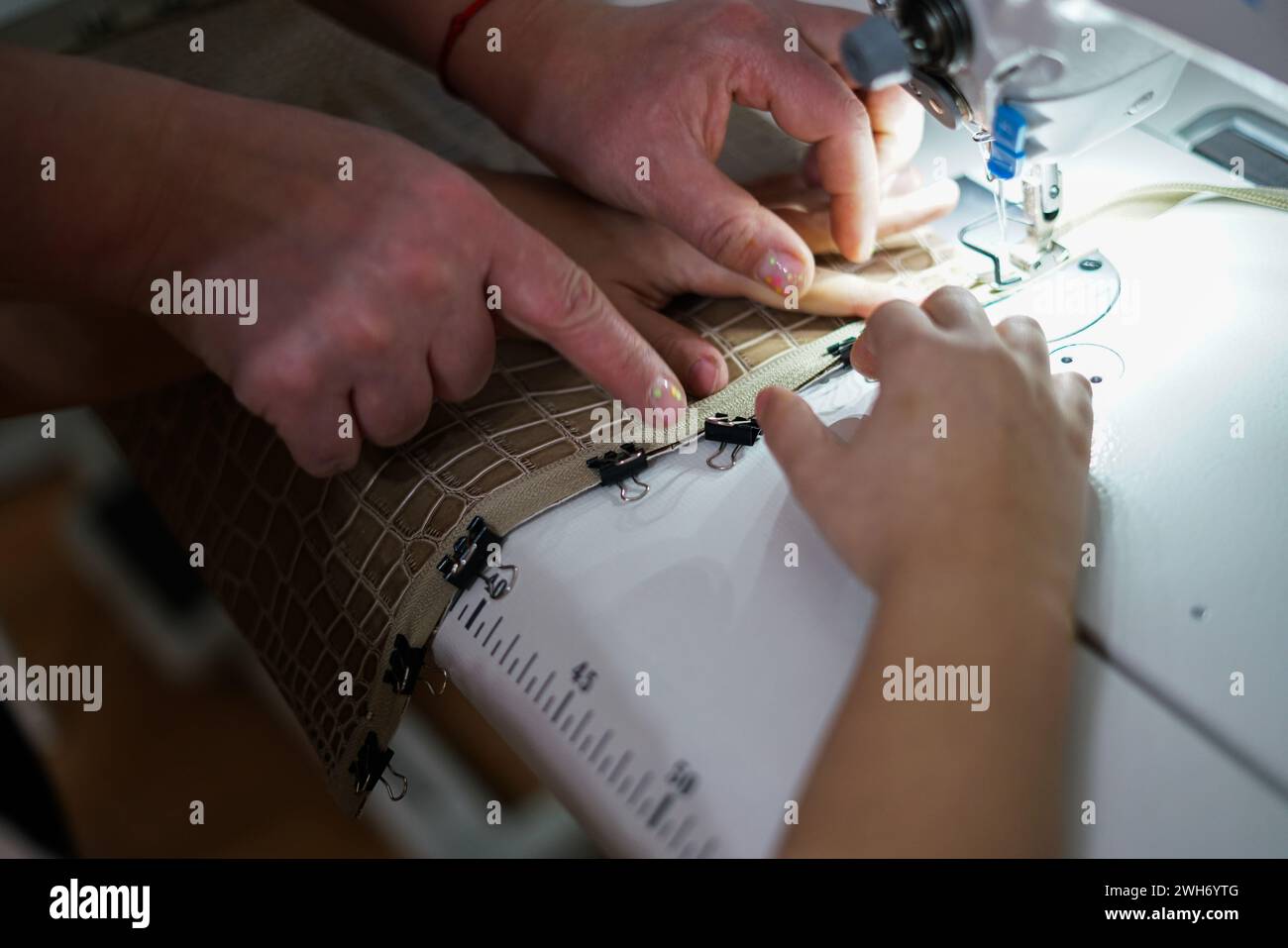 Working in the sewing studio. Sewing machine Stock Photo - Alamy