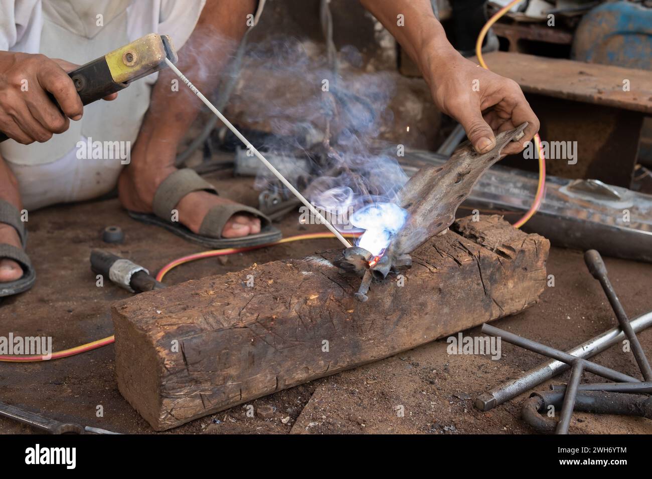 Welders work on welding metal. Men working in welding workshop Stock ...