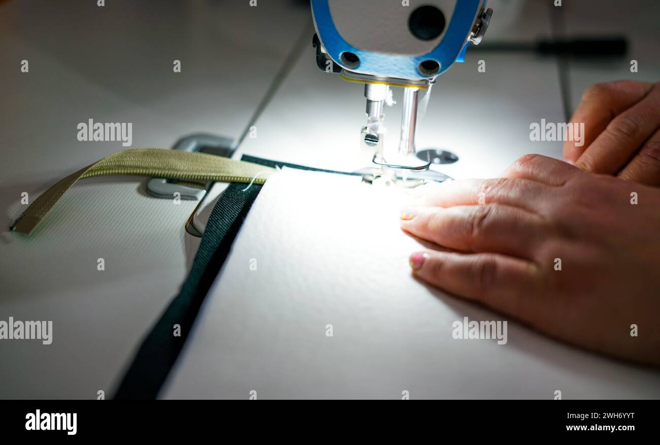 Working in the sewing studio. Sewing machine Stock Photo - Alamy