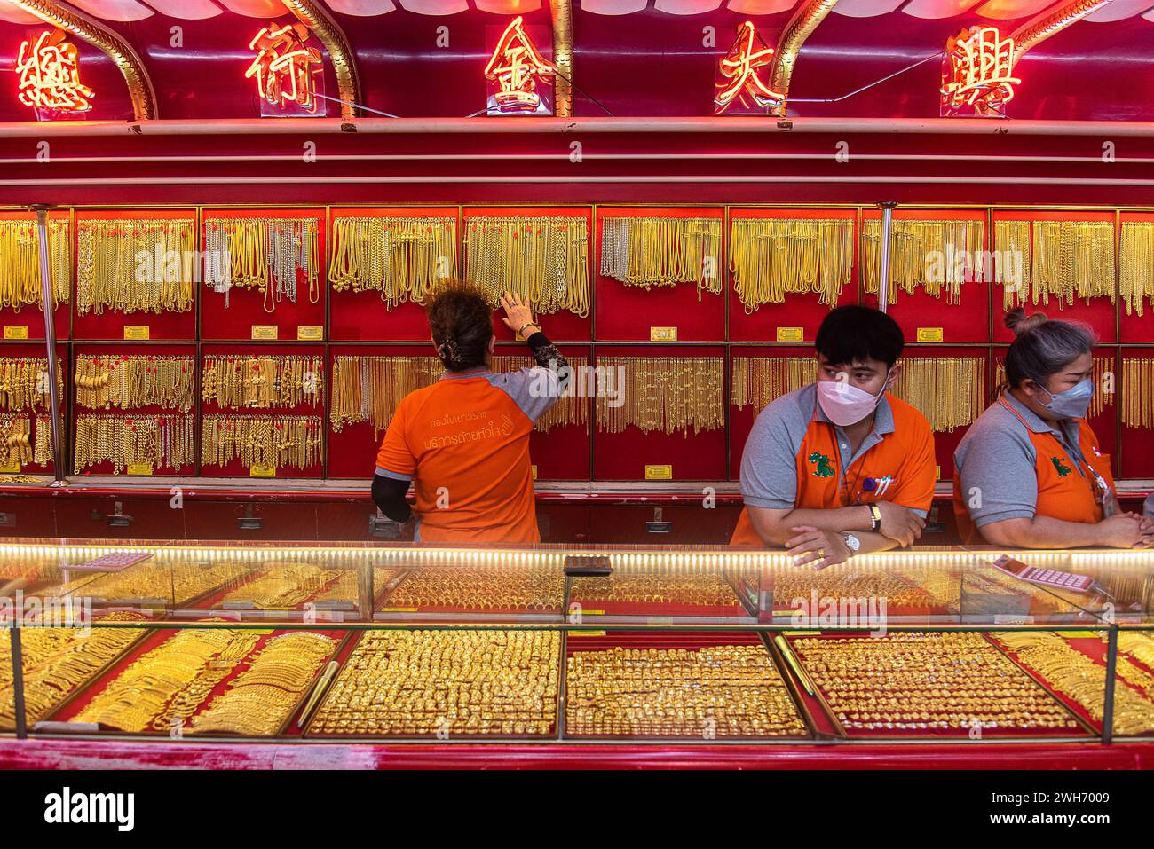 A gold seller seen prepares gold for sale at the gold shop in Chinatown ...