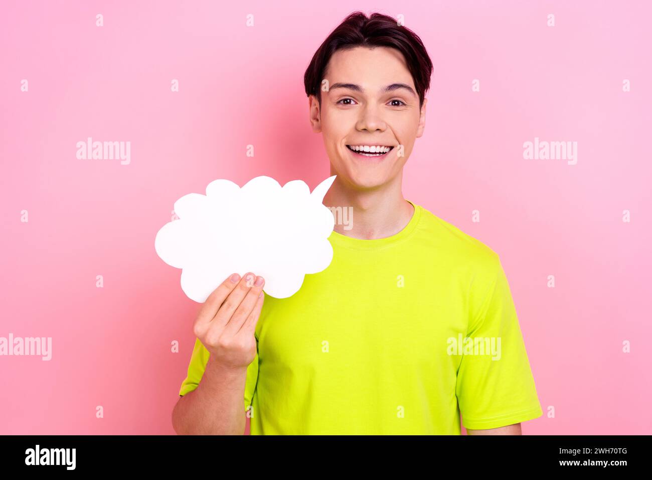 Photo portrait of pretty teen man hold paper comics cloud speak wear ...