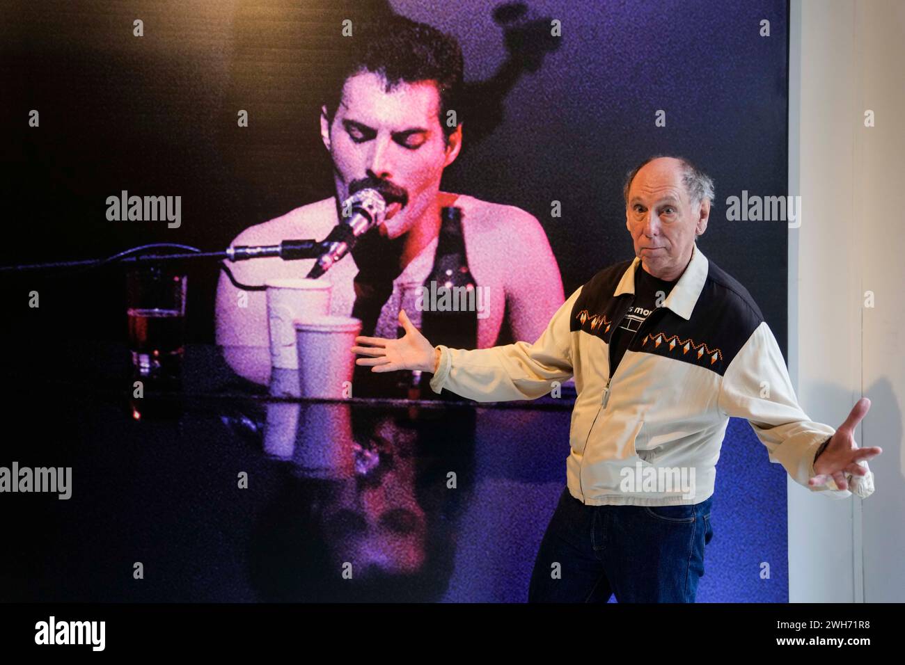 Photographer Peter Hince poses in front of one of his picture during ...
