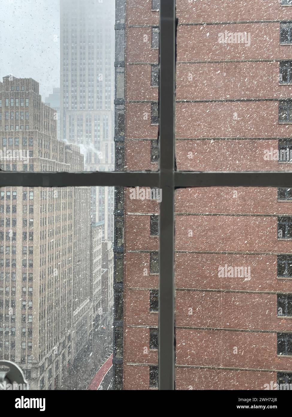 Snowfall through a casement window in an apartment in Murray Hill, 2024 ...