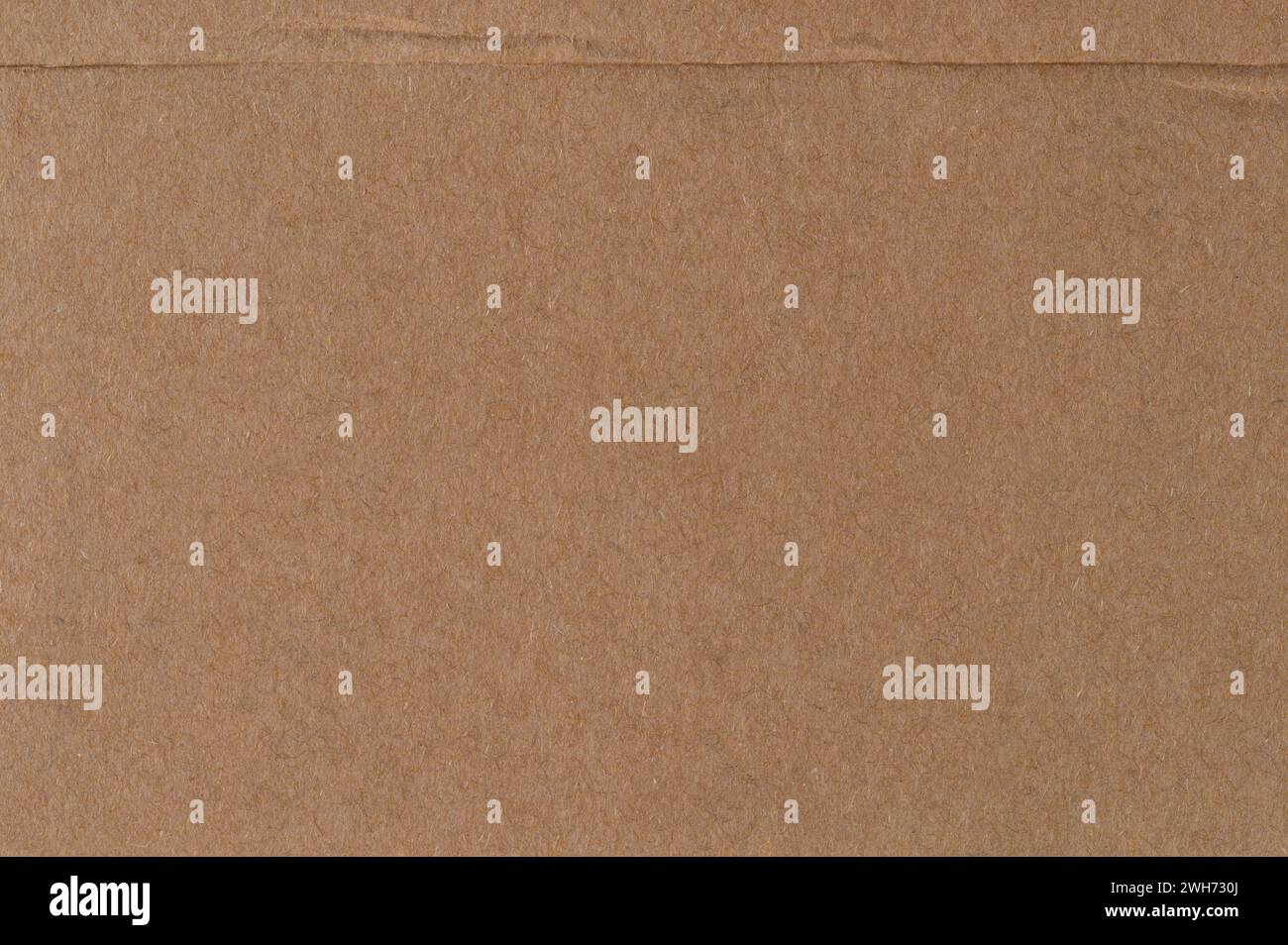 Crease line on brown paper sheet macro close up view Stock Photo - Alamy
