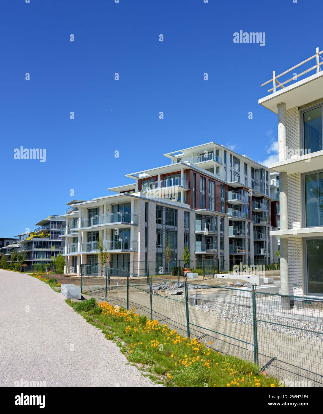 Gravel pathway along the new residential buildings under construction ...
