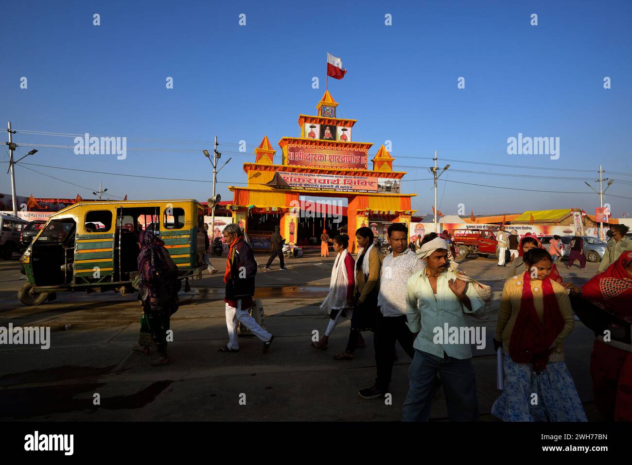 Indian Hindu devotees arrive for a holy dip at the Sangam, the ...