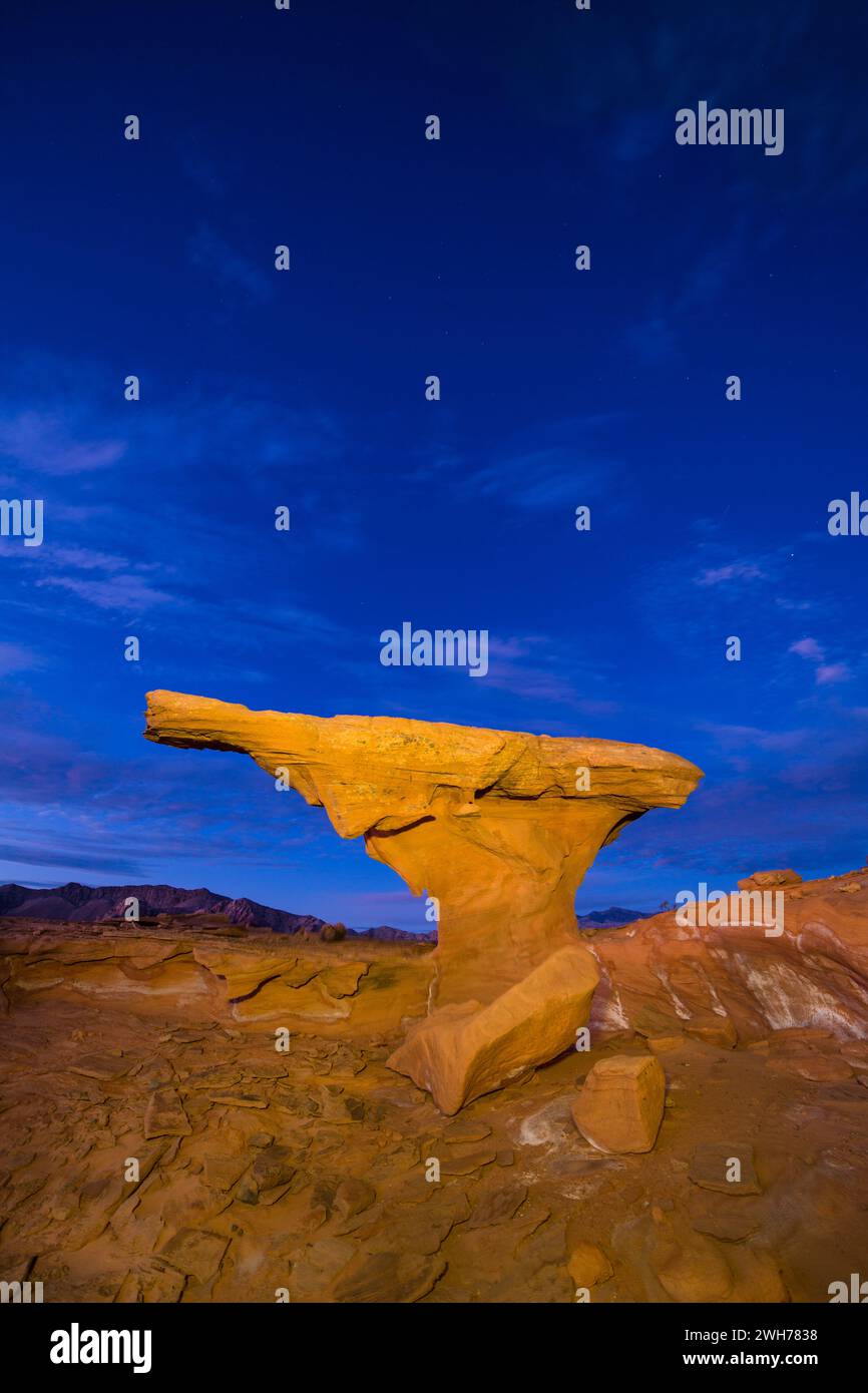 Colorful eroded Aztec sandstone formation at evening twilight in Little ...