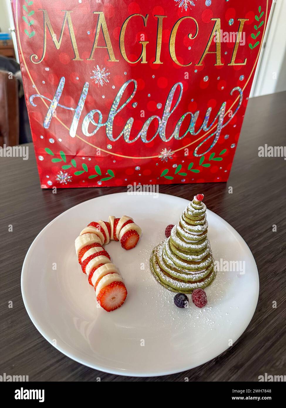A Christmas holiday breakfast with a pancake Christmas tree and a ...