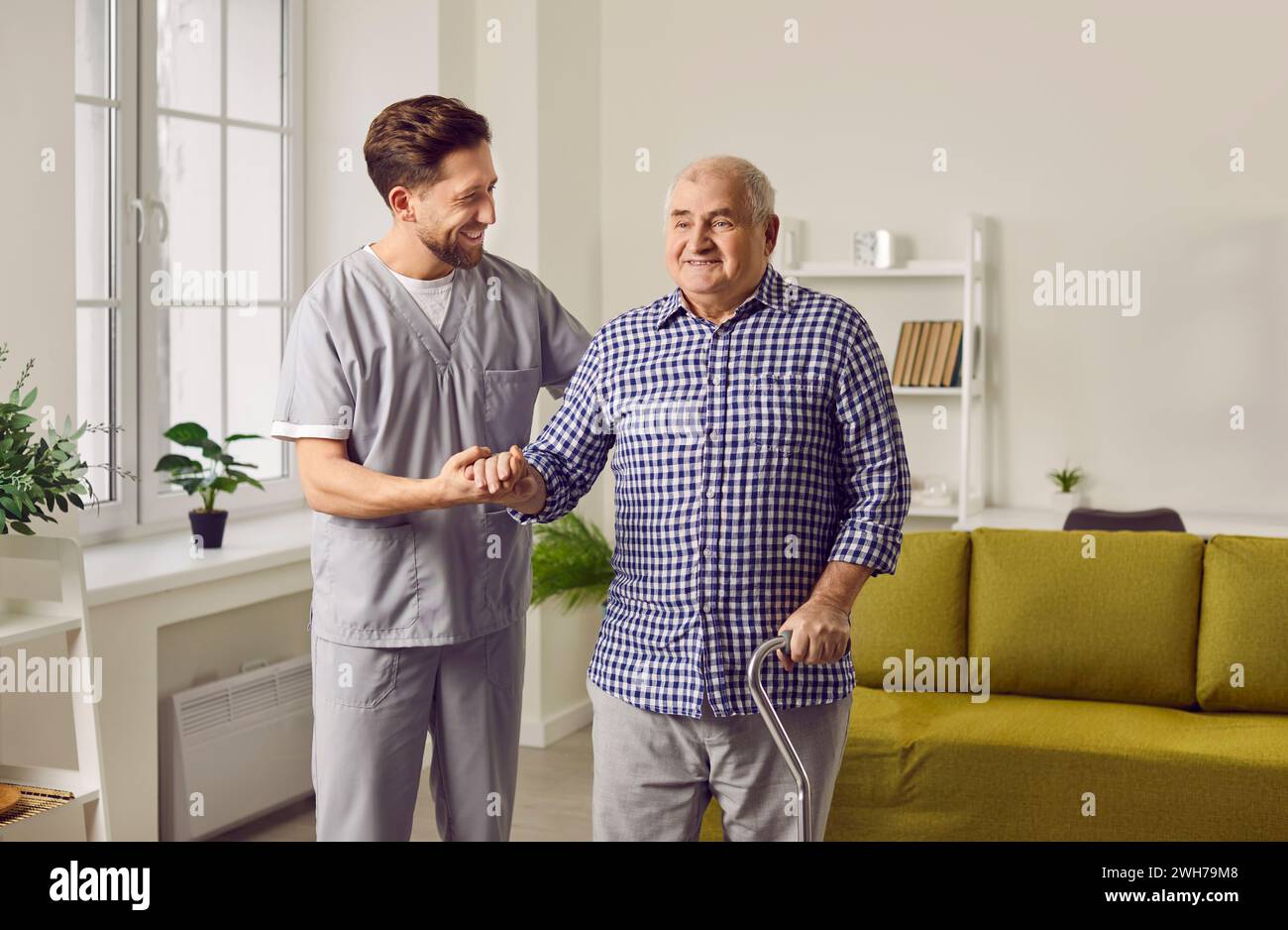 Young caring male nurse hi-res stock photography and images - Alamy