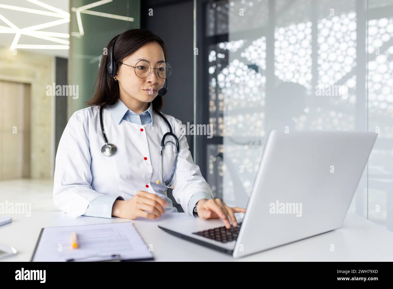 Doctor offers remote medical assistance hi-res stock photography and ...