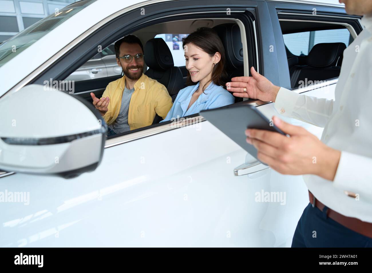 Car dealership manager advises hi-res stock photography and images - Alamy