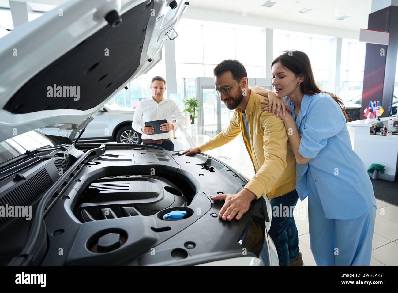 Man woman under car hood hi-res stock photography and images - Alamy