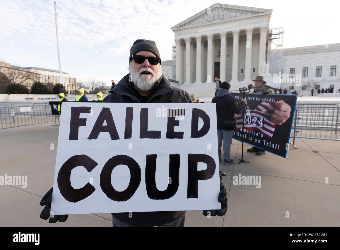 Bill Christeson holds a banner in front of the U.S. Supreme Court ...