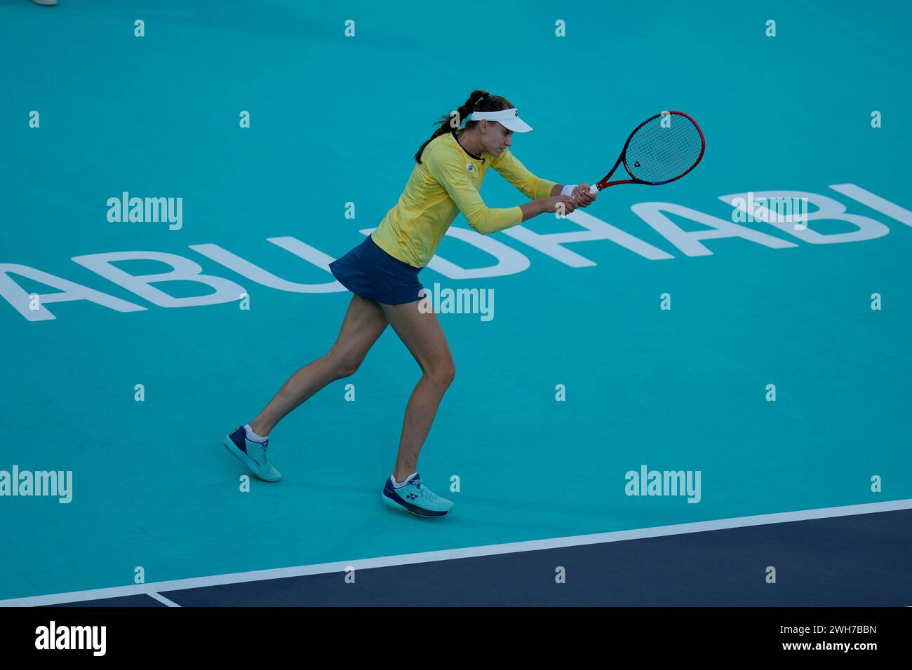 Elena Rybakina of Kazakhstan returns the ball to Danielle Rose Collins ...