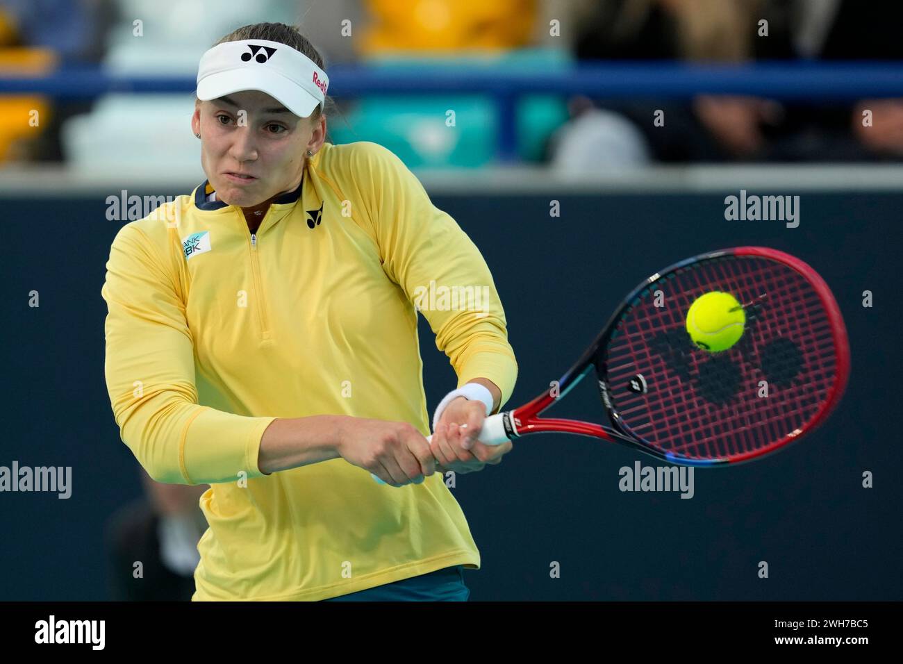 Elena Rybakina of Kazakhstan returns the ball to Danielle Rose Collins ...