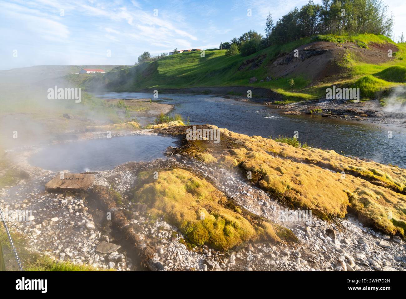 Steamy view of the natural hot springs surrounded in the Secret Lagoon ...