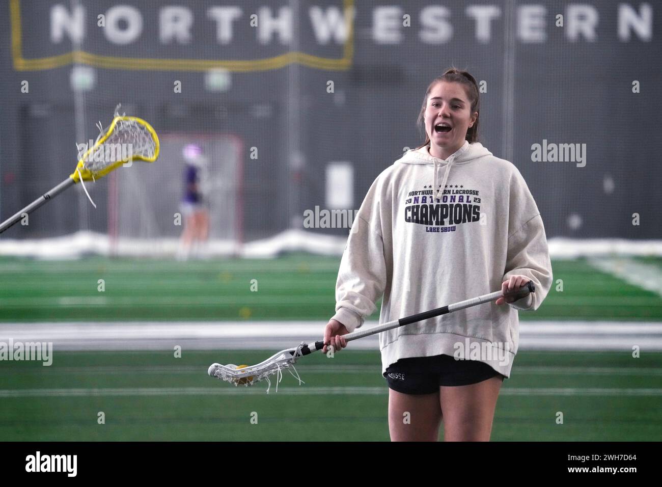 Northwestern's Izzy Scane talks to a teammate while warming up for ...