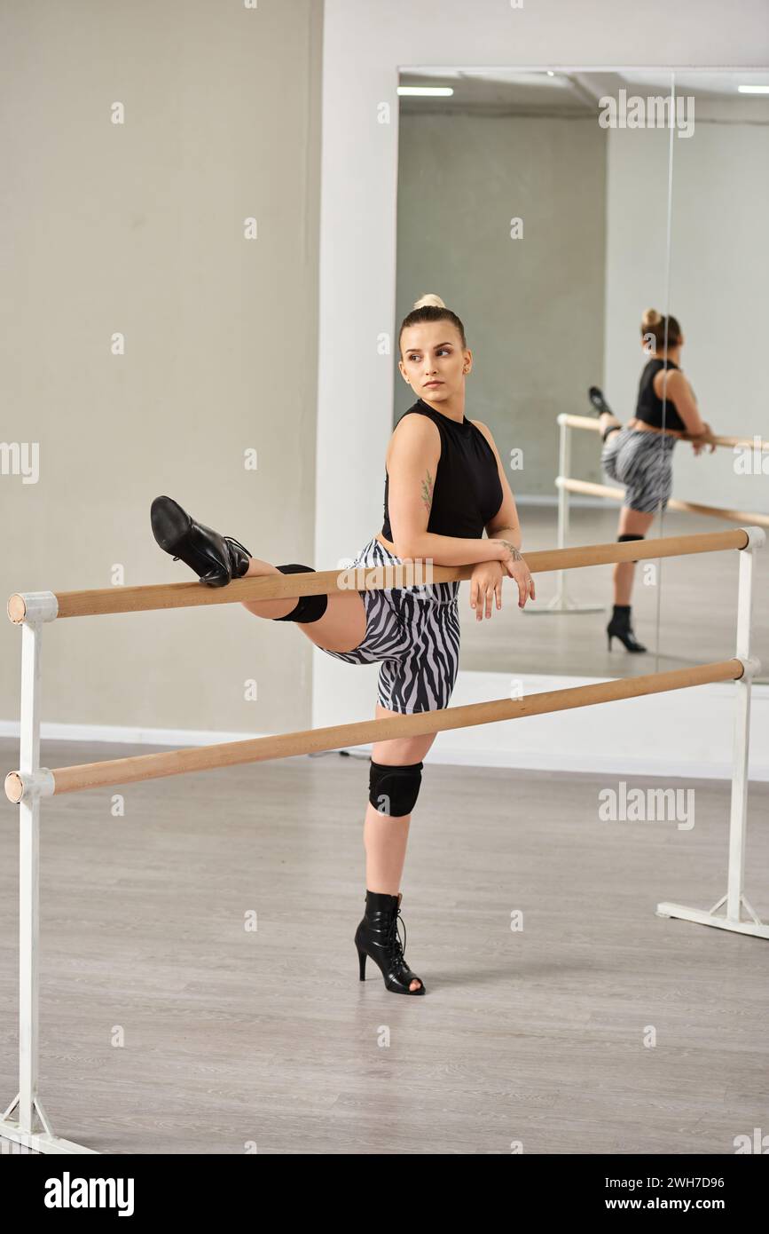 graceful dancer finds balance and strength as she stretches on the ...