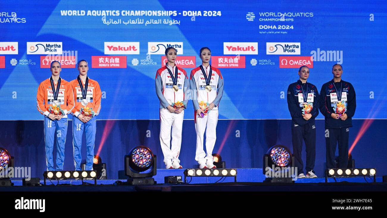 Doha, Qatar. 8th Feb, 2024. Gold medalists Wang Liuyi/Wang Qianyi (C) of China, silver medalists ...