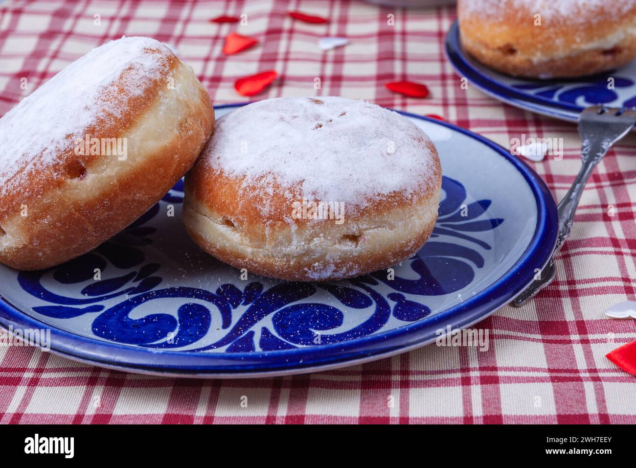 The picture shows two stimulating doughnuts on a plate. The doughnuts ...