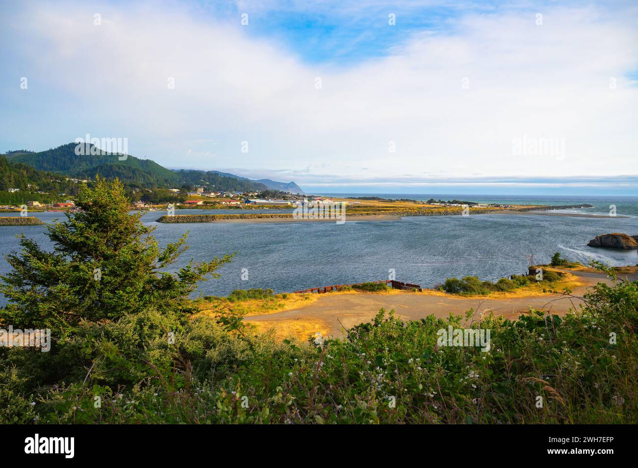 Coastal landscape of Gold Beach, Oregon, with Rogue River and mountains ...