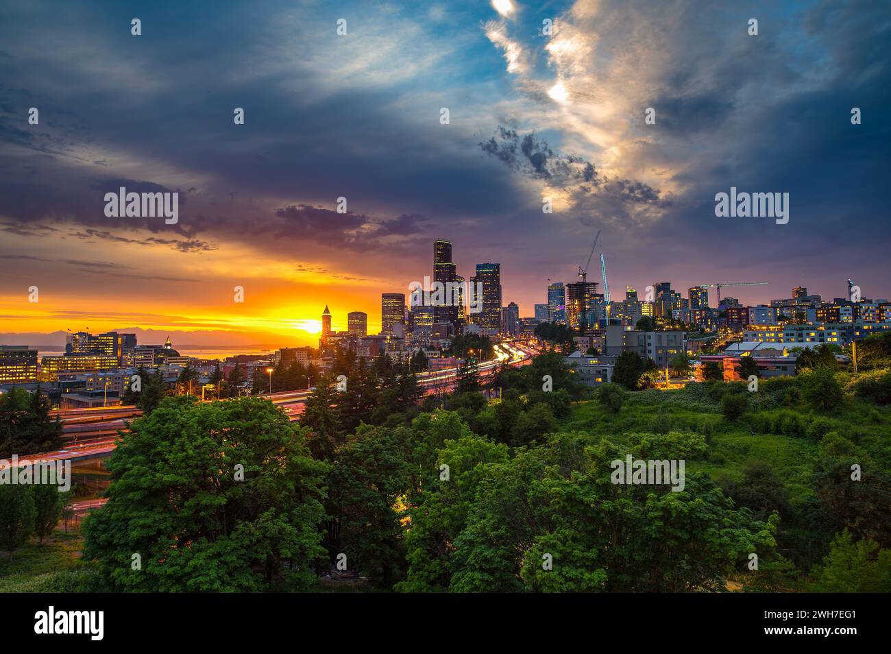Dramatic sunset over Seattle skyline with highway in foreground Stock ...