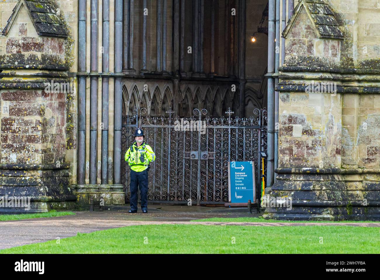 Police officer in yellow jacket on security patrol at Salisbury ...