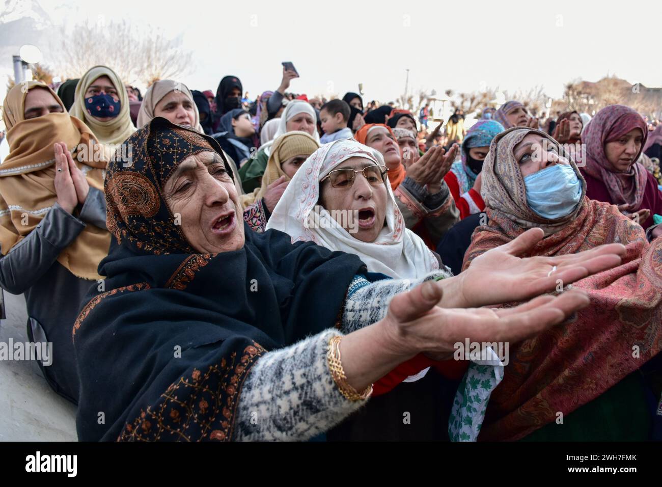 Kashmiri Muslim devotees pray upon seeing a relic believed to be a hair ...