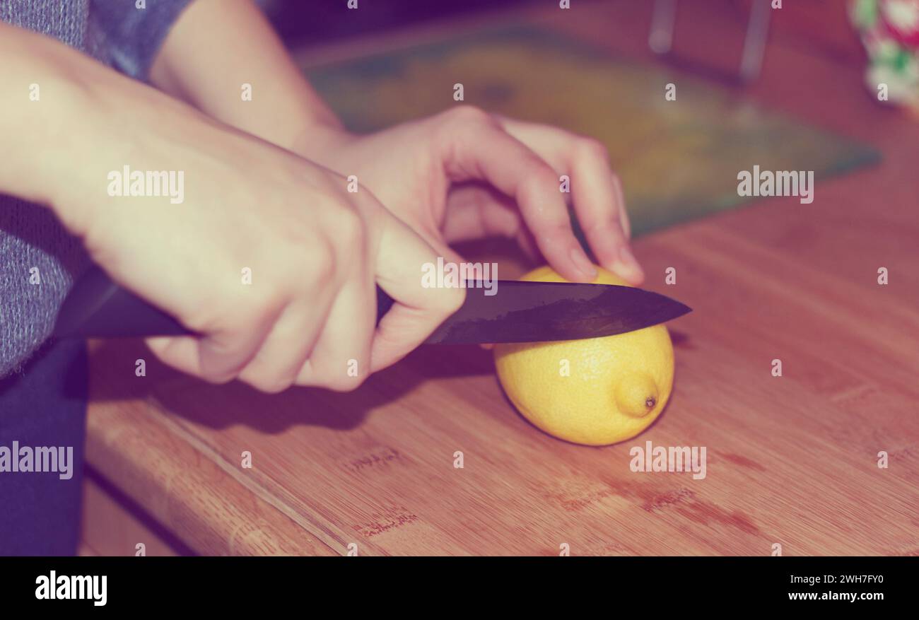 Female hands cutting fresh ripe hi-res stock photography and images - Alamy