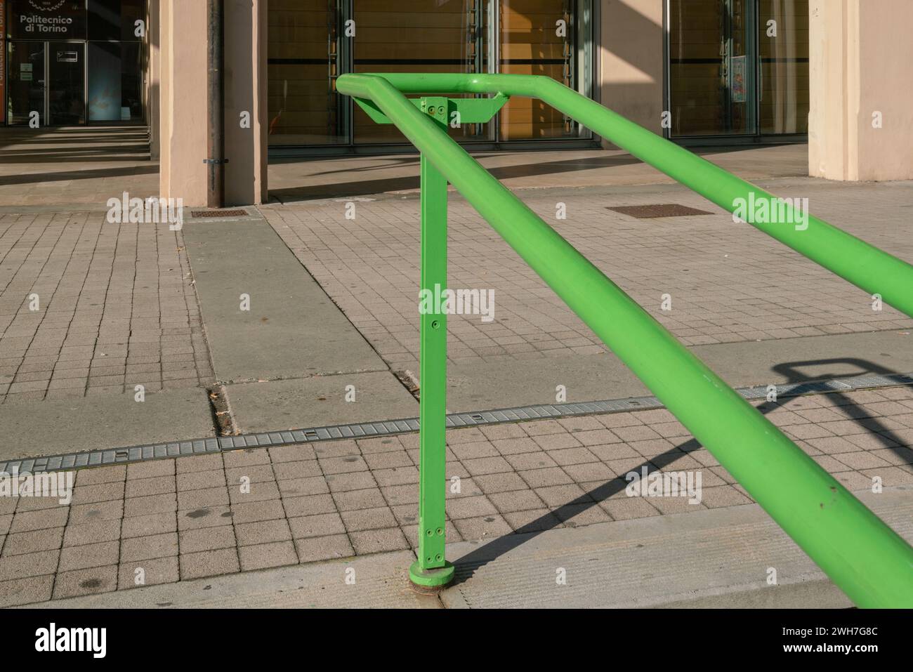 handrail positioned at the entrance of a public building, to support ...