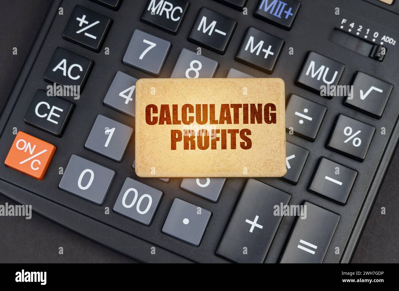 Financial concept. There is a sign on the calculator that says ...