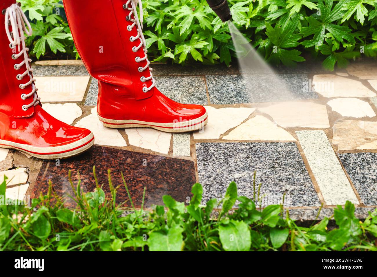 Washing mud off boots hi-res stock photography and images - Alamy
